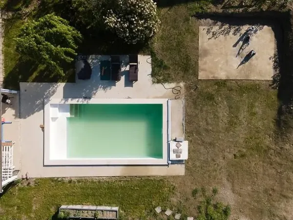 Drone flight over pool in the middle of greenery Our beautiful Wall Art ...