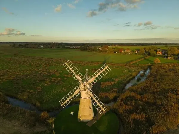A serene shot of the historic Thurne Windmill in Norfolk